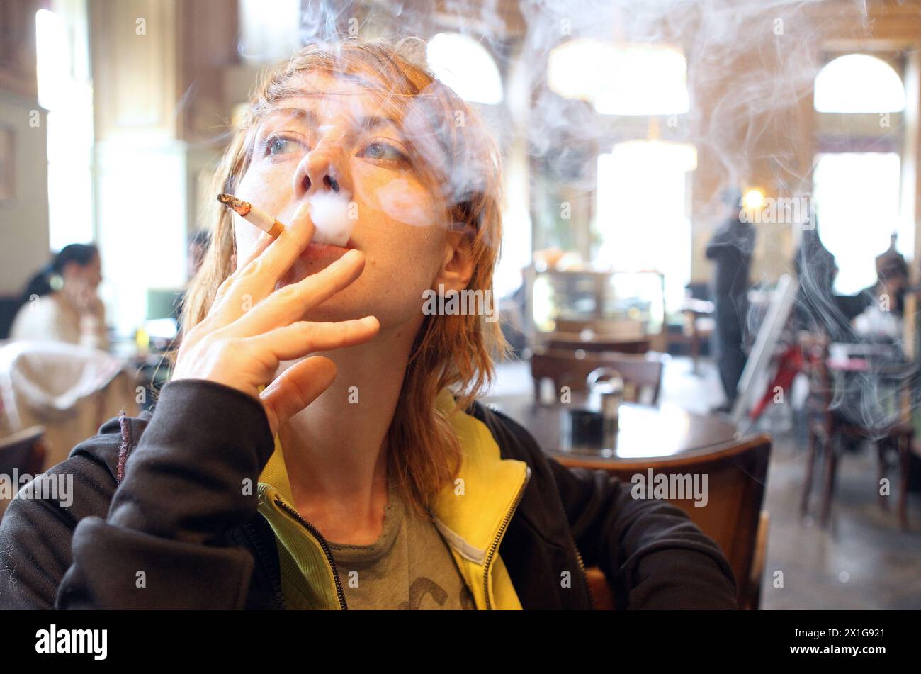 A woman smoking in a Viennese Cafe, captured on 12 April 2010 ...