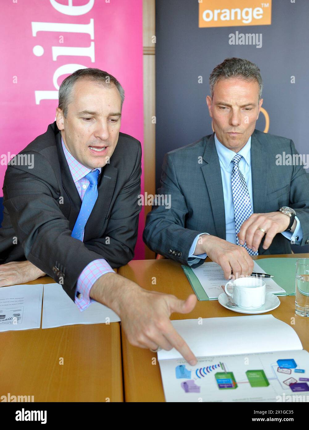 T-Mobile Austria CEO Robert Chvatal and Orange-Austria CEO Michael ...