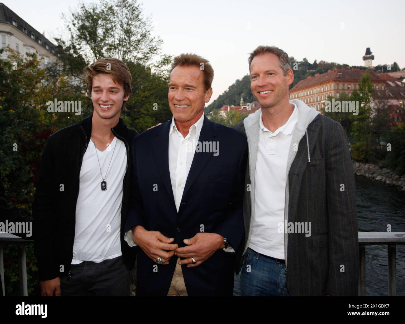Arnold Schwarzenegger and his son Patrick and his nephew Patrick Knapp (r) visit Graz on 6 ...