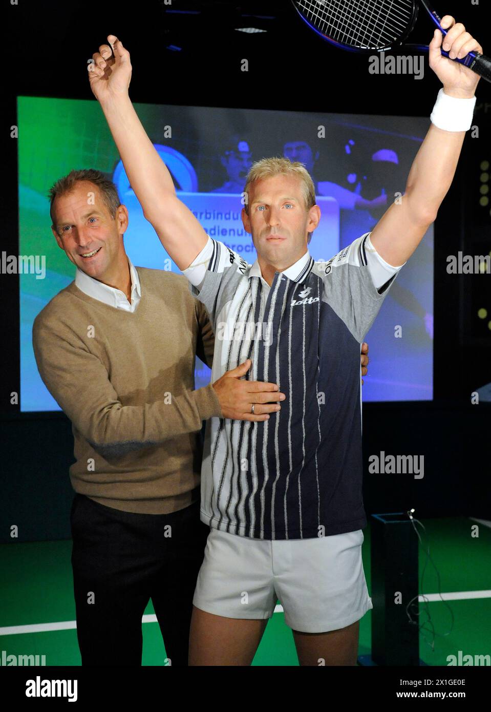 Austrian tennis player Thomas Muster poses next to his wax figure in ...