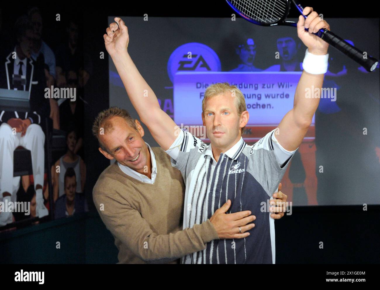 Austrian tennis player Thomas Muster poses next to his wax figure in ...