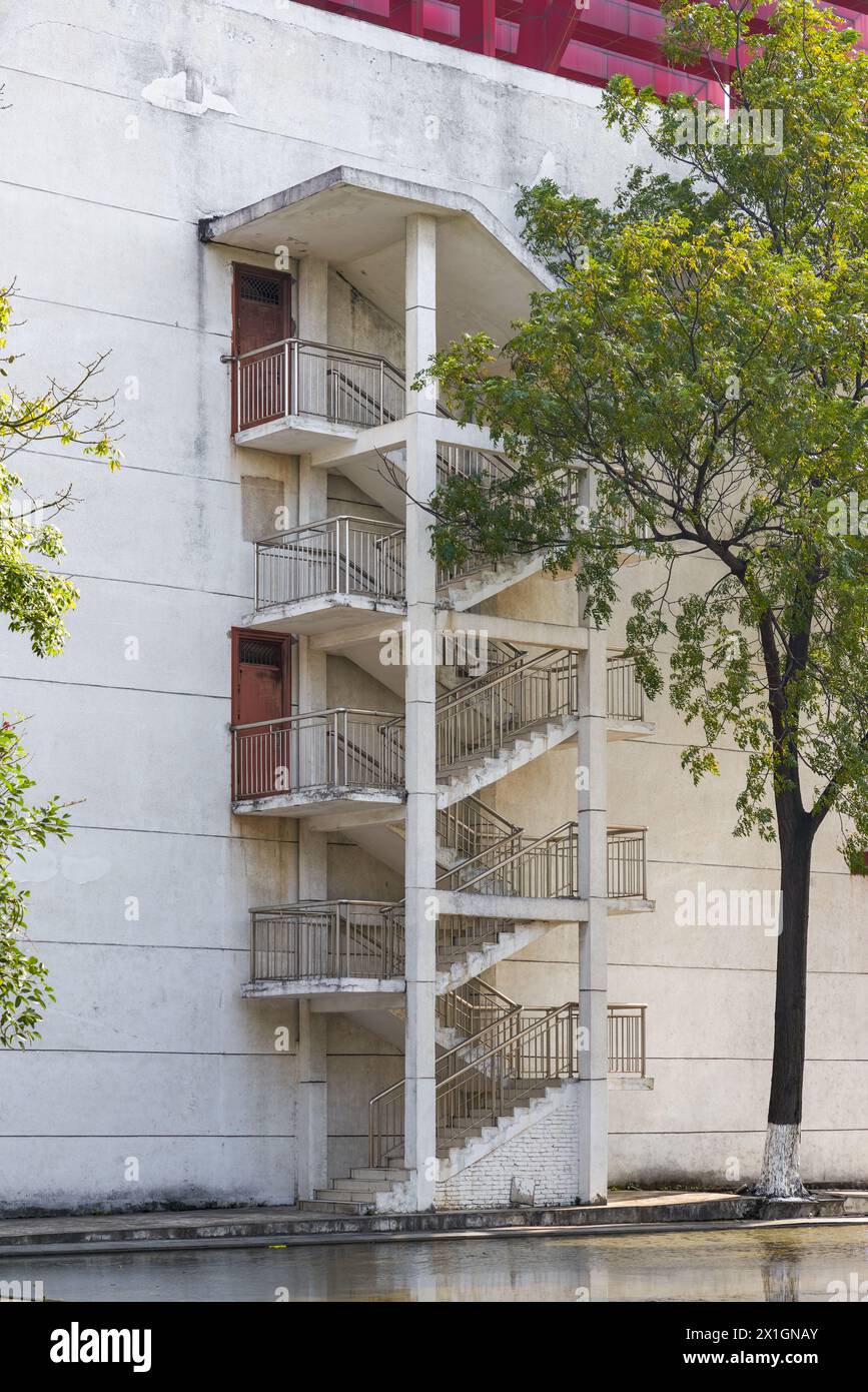 Close-up of reciprocating stairs hanging on the exterior wall of a ...
