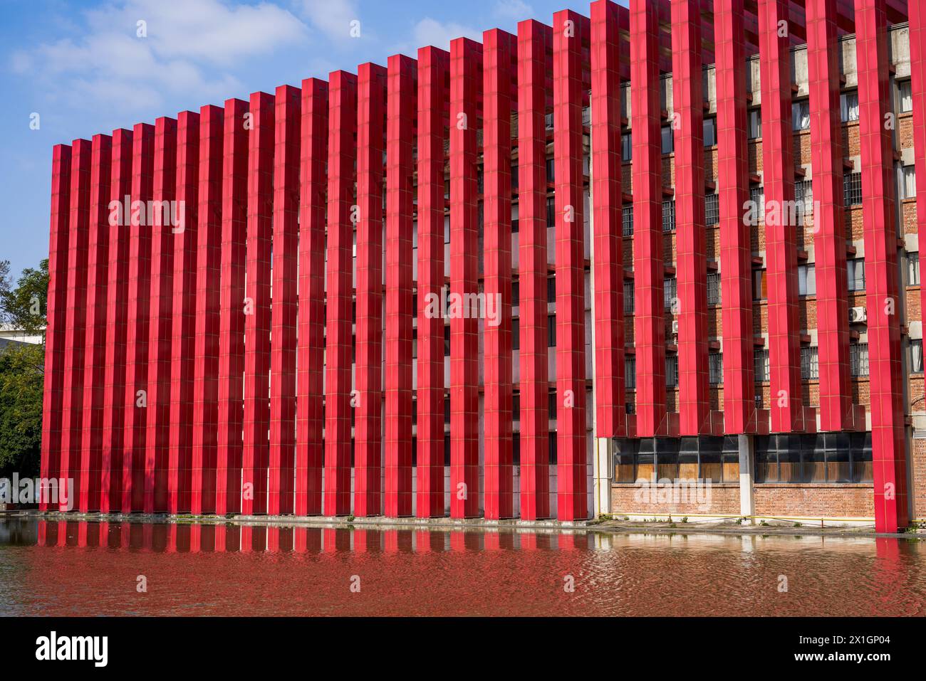A modern design red striped building in a Chinese city Stock Photo - Alamy