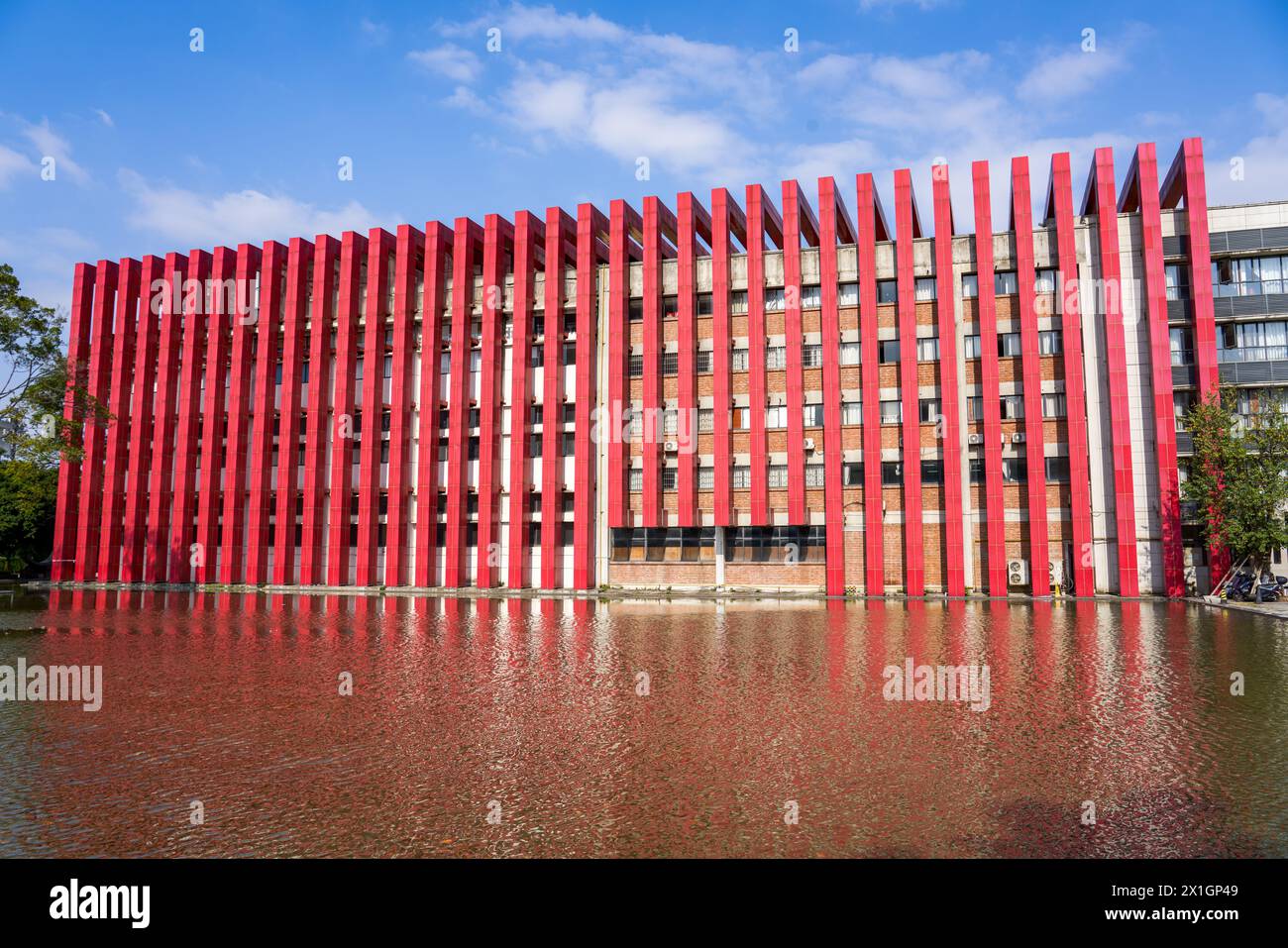 A modern design red striped building in a Chinese city Stock Photo - Alamy