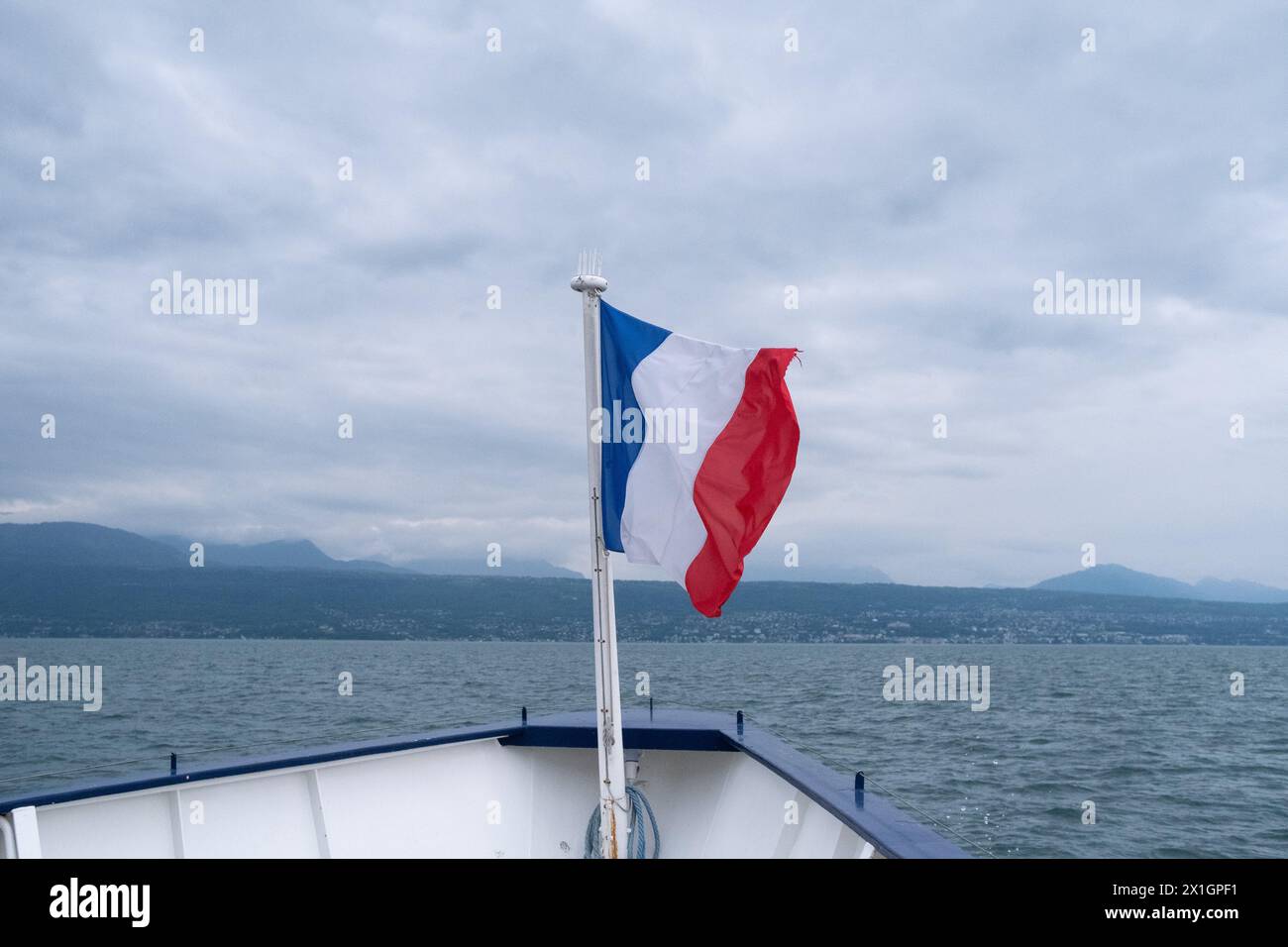 French flag on the ferry boat shuttling on Lake Geneva between the town ...