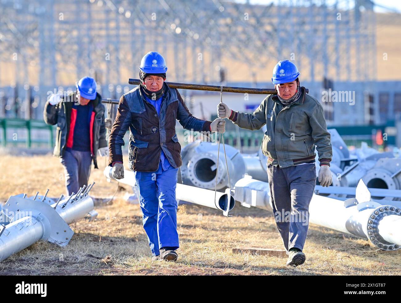 XILINGOL LEAGUE, CHINA - APRIL 17, 2024 - Power workers work at the ...