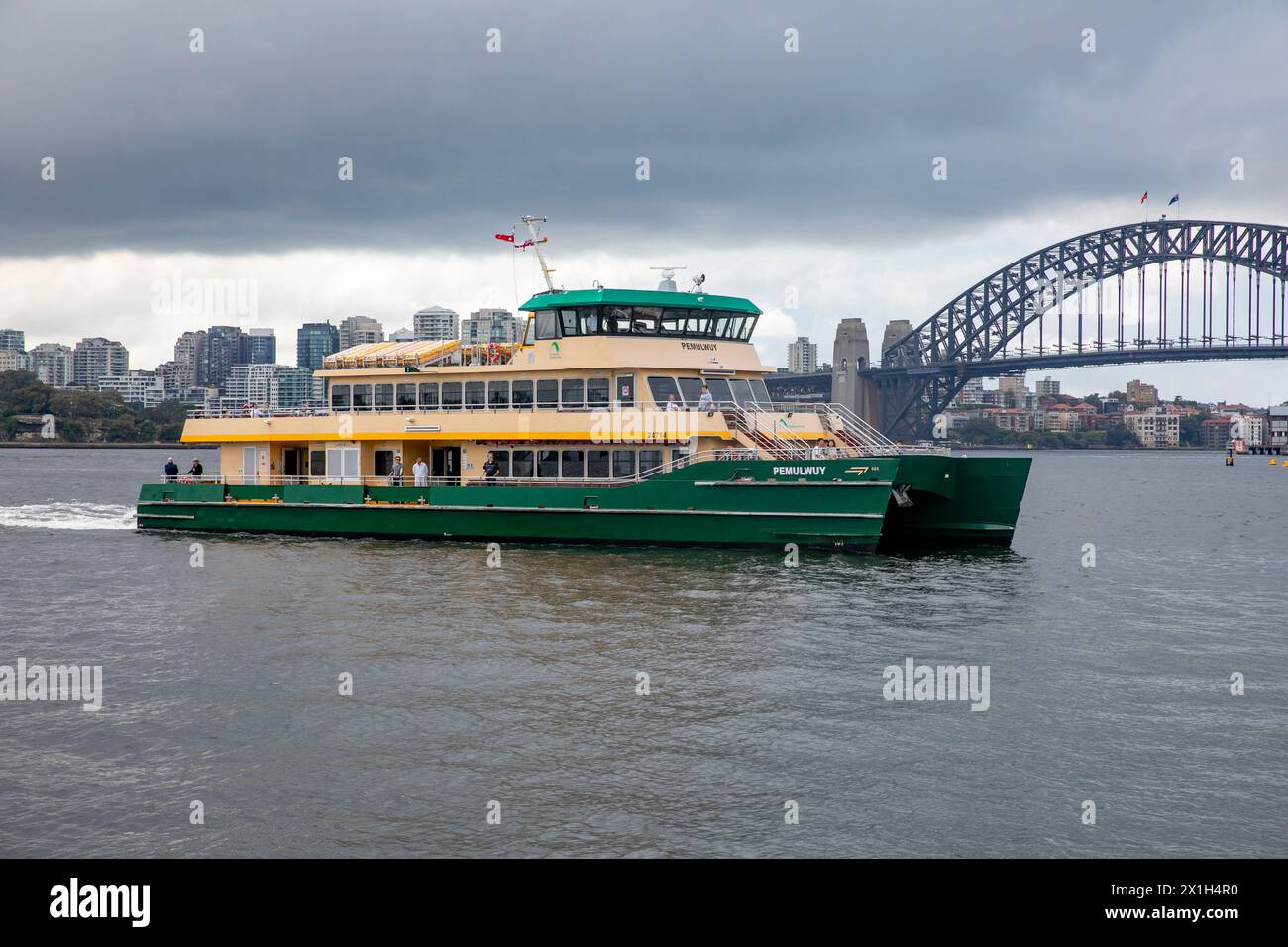 Sydney ferry, the MV Pemulwuy, travels on Sydney Harbour past the ...