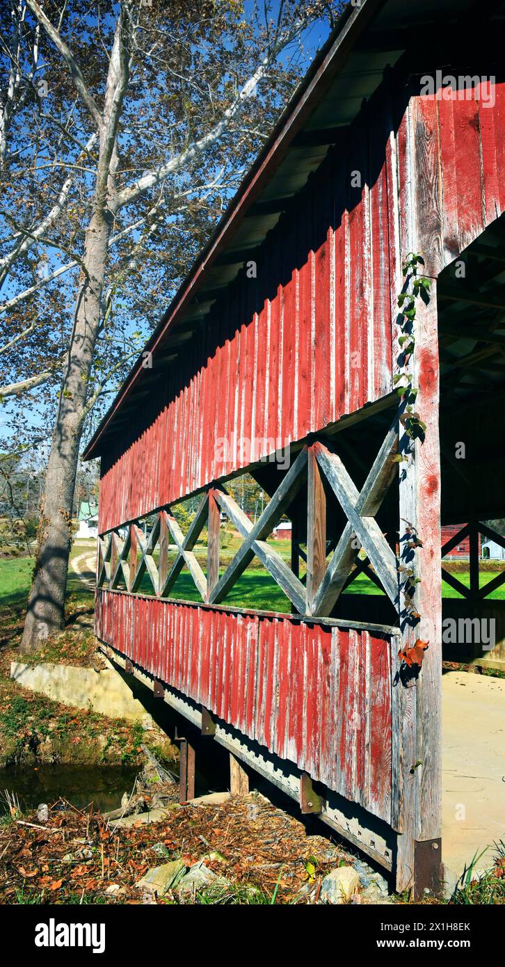 Criss-crossed boards form windows on this covered bridge. Bridge is ...