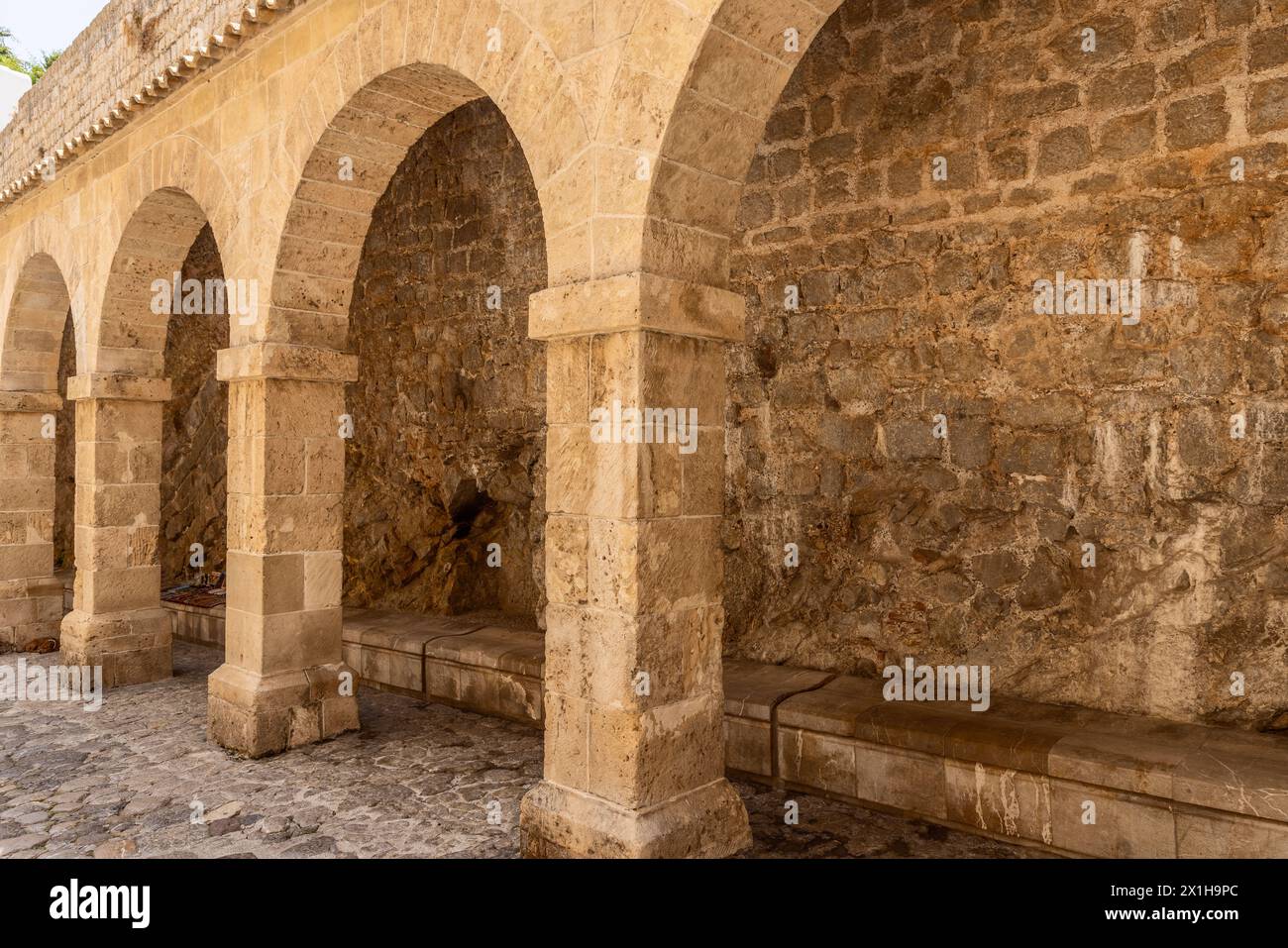 The elegant portico with arches at the main entrance of Almudaina ...