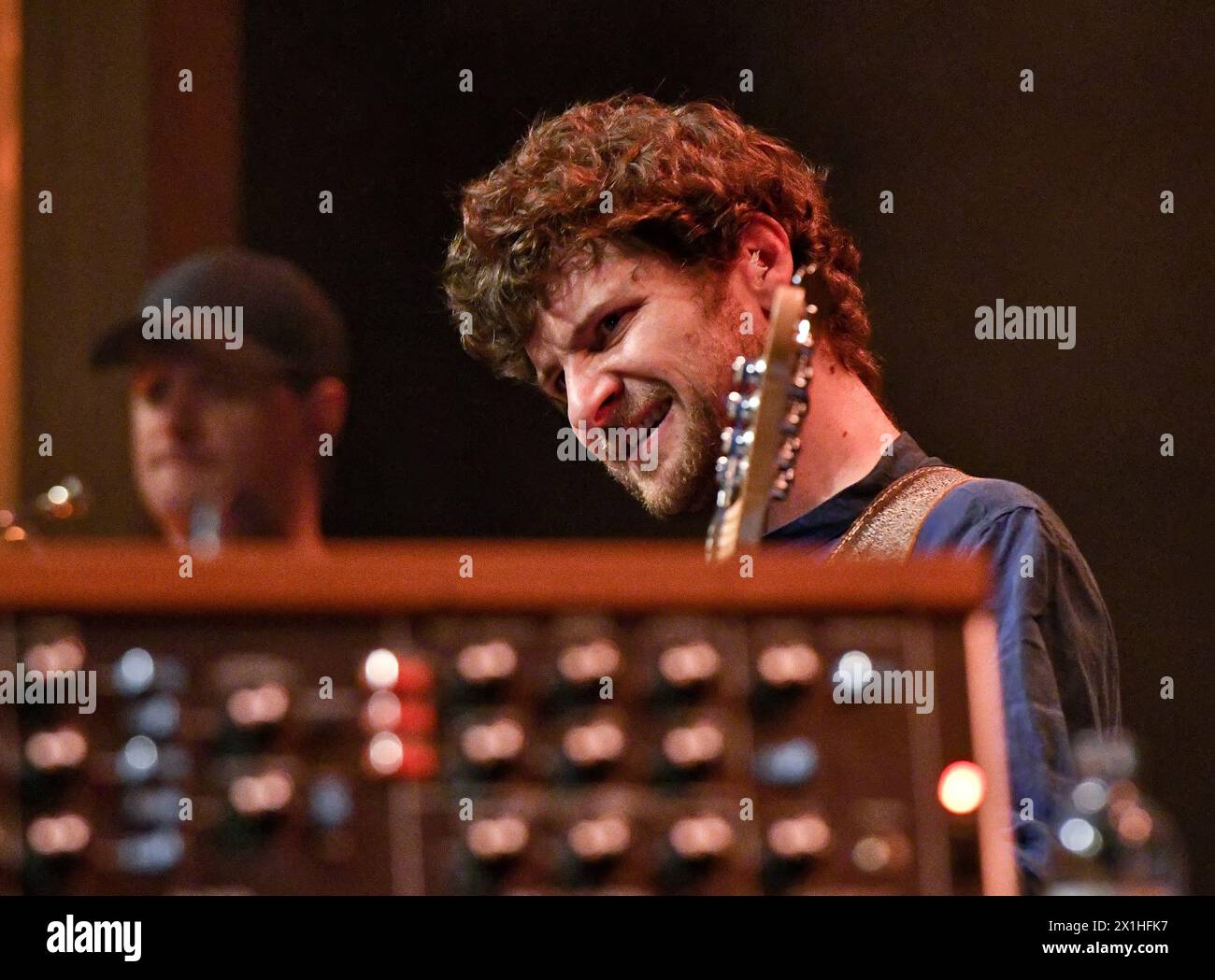 Snarky Puppy band leader, Michael League, performs on stage during a ...