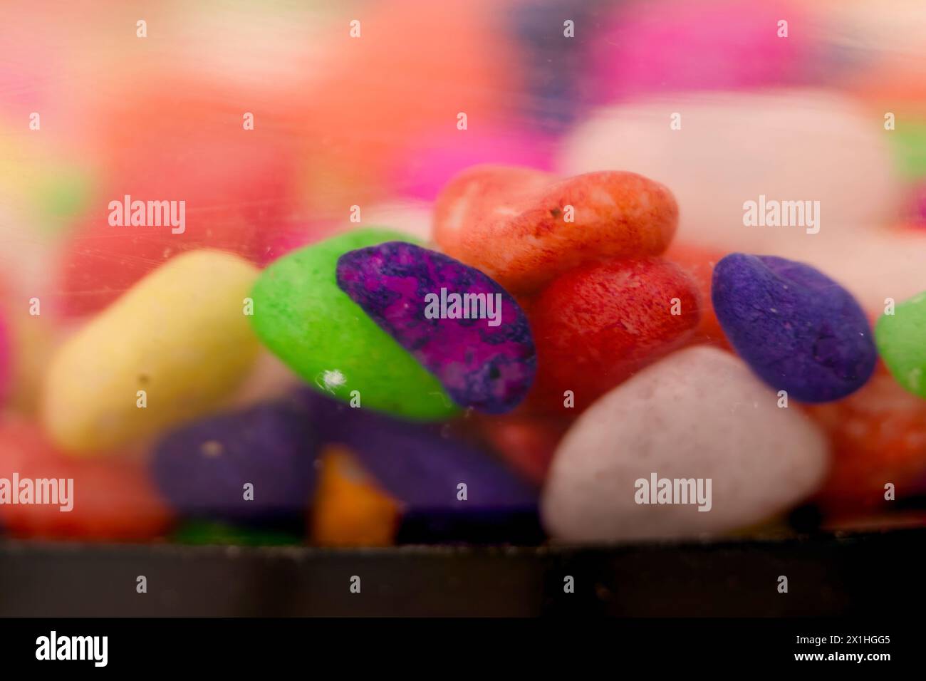 This images is about Colorful stones on a black background. Shallow ...