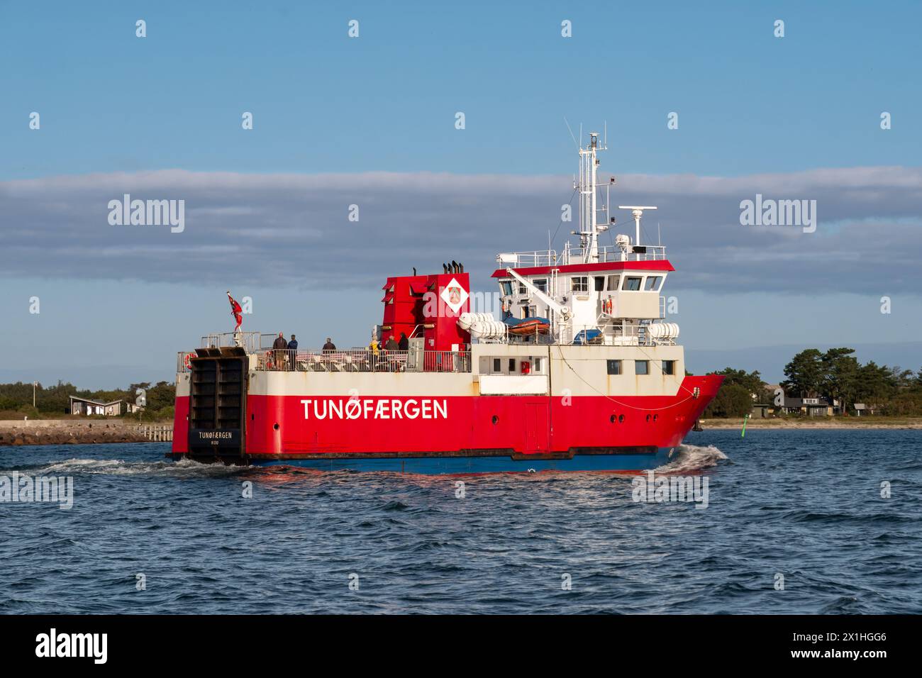 Ferry boat Tunøfaergen with passengers approaching harbour of Tunø ...