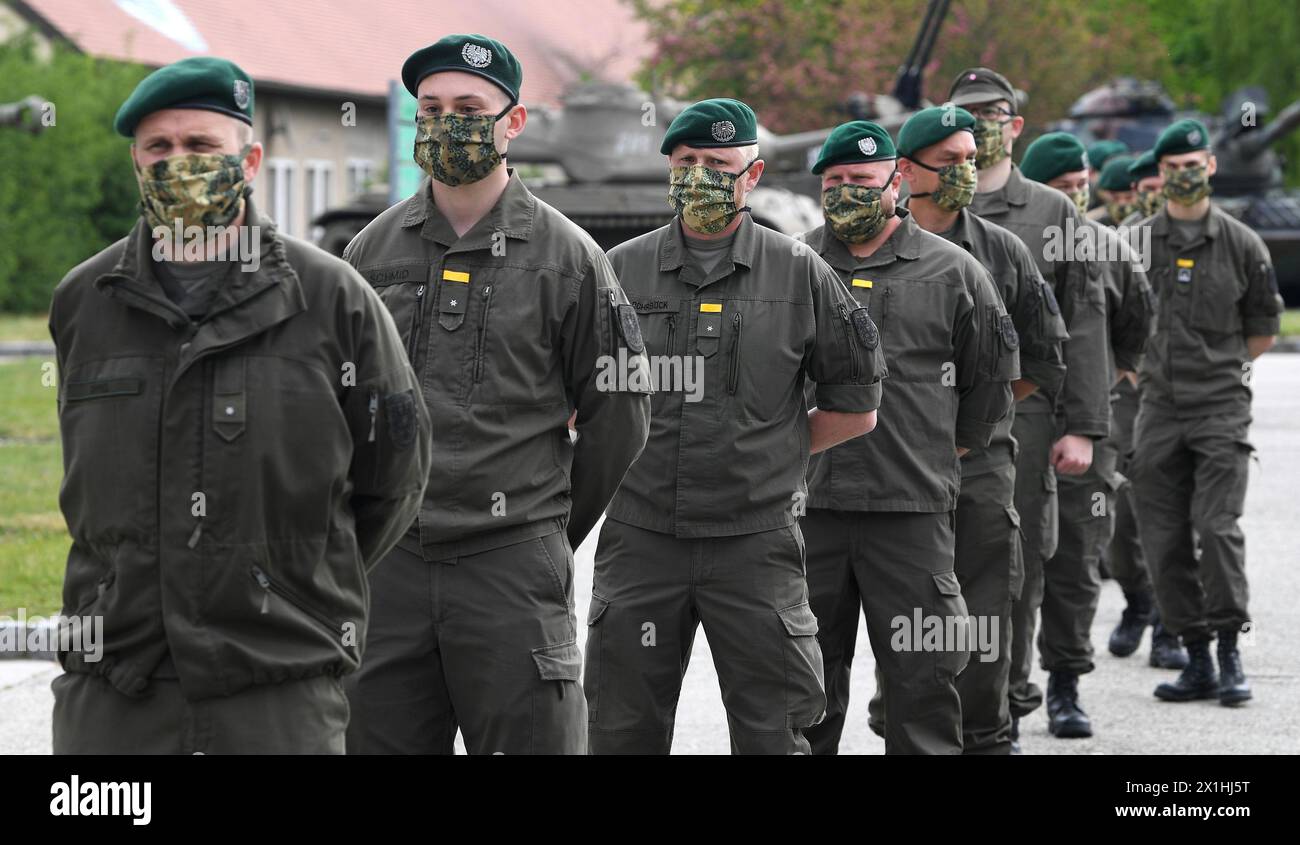 Austrian armed forces soldiers wear face masks as they line up at the ...
