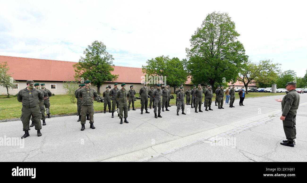 Austrian armed forces soldiers wear face masks as they line up at the ...