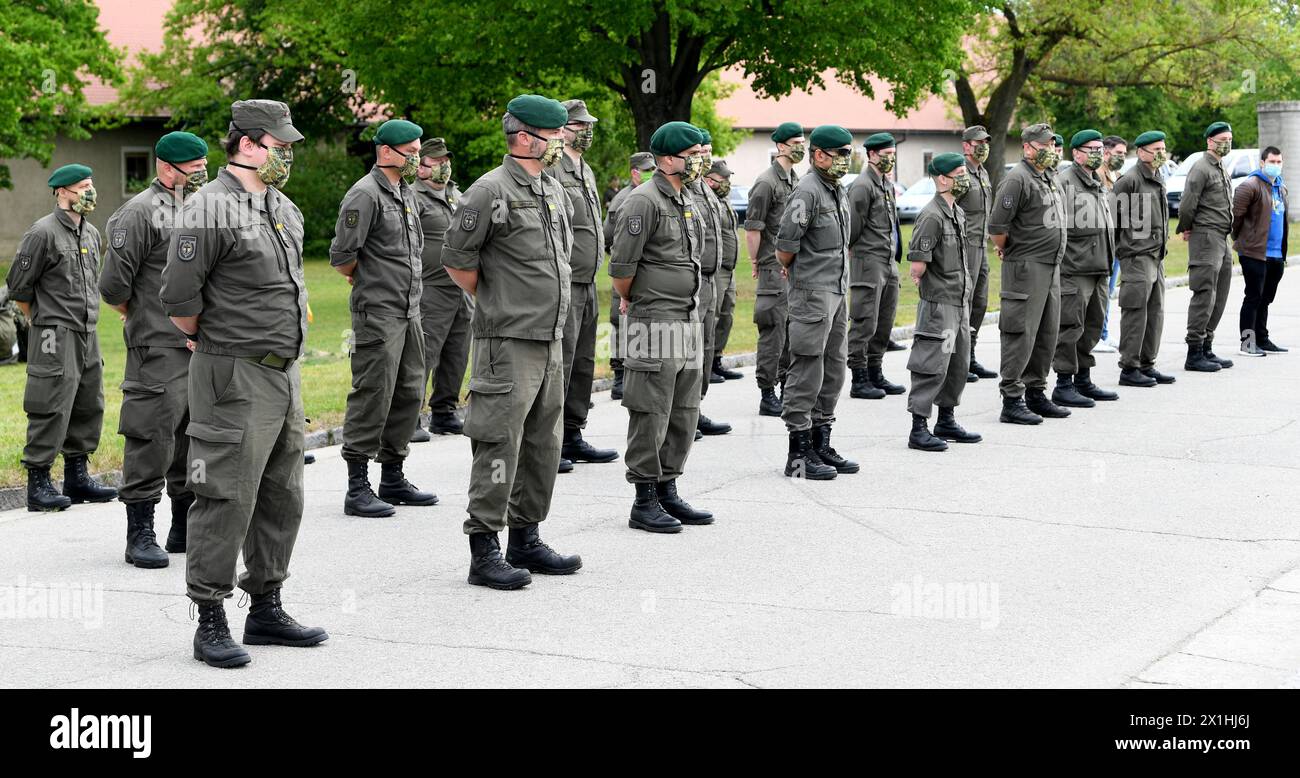 Austrian armed forces soldiers wear face masks as they line up at the ...