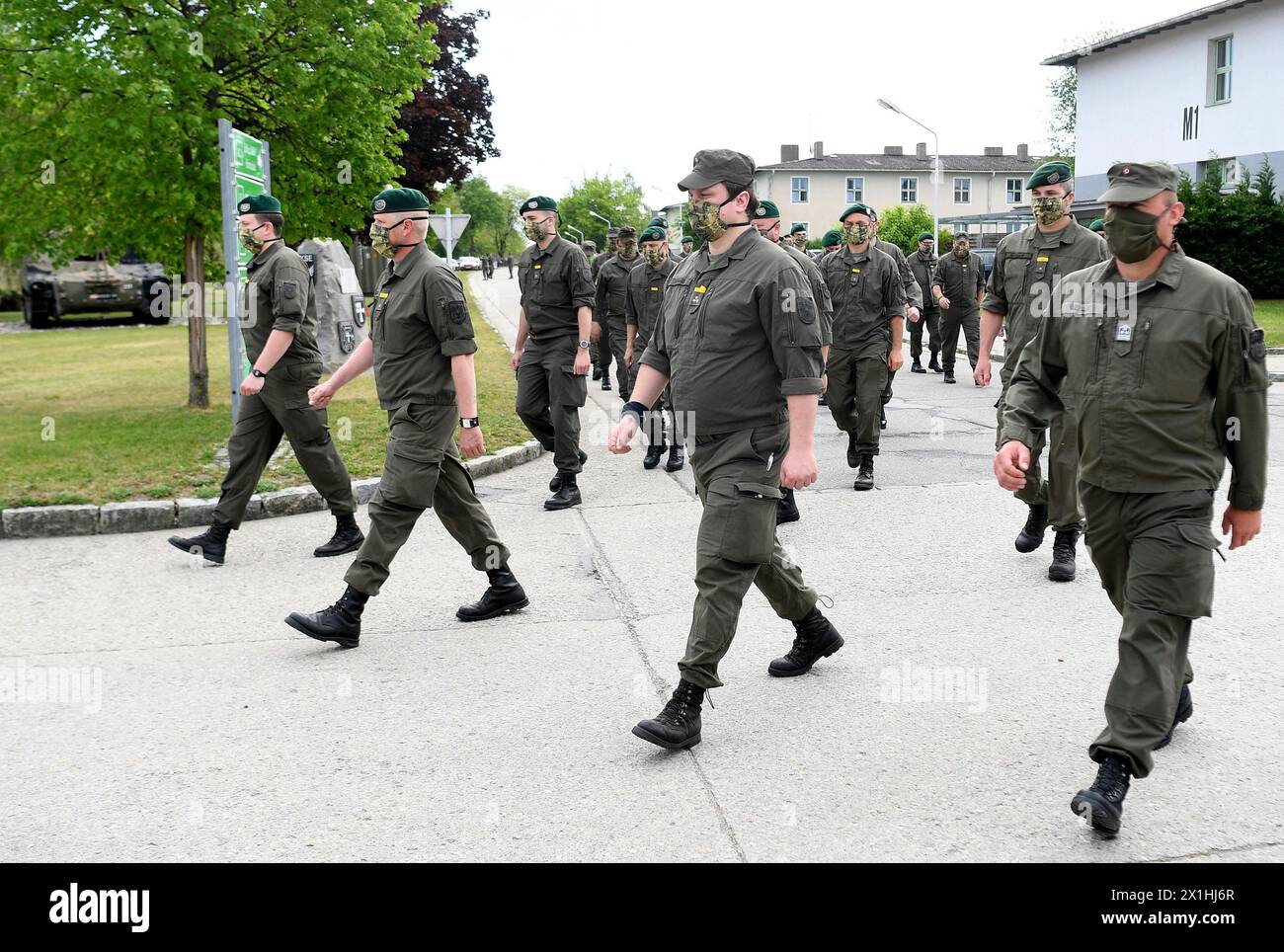 Austrian armed forces soldiers wear face masks as they line up at the ...