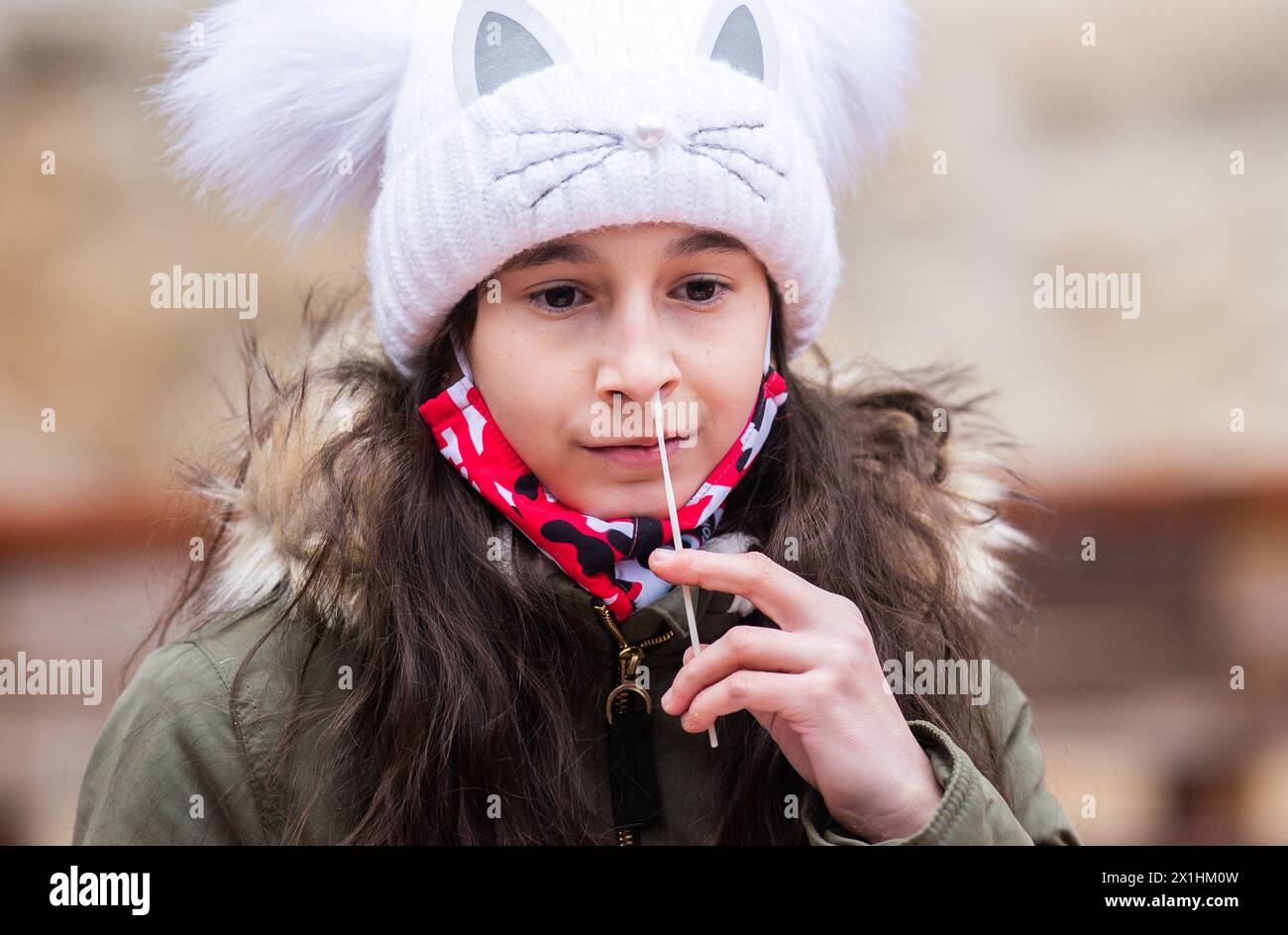 A school child in a rapid antigen test on February 8, 2021, as part of ...