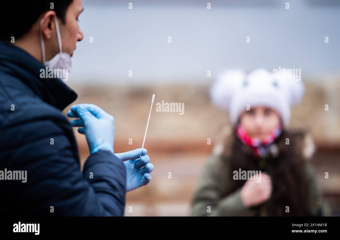 A school child in a rapid antigen test on February 8, 2021, as part of ...