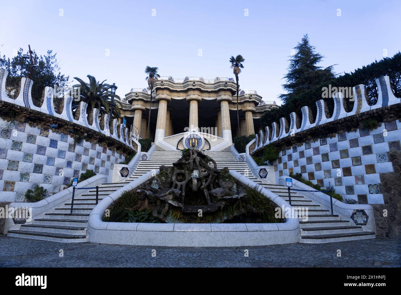 A view of the stairs that lead up to the Park Güell, with its famous ...