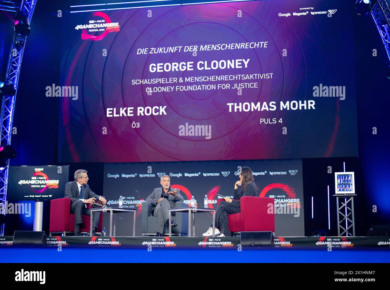 Thomas Mohr (PULS 4), George Clooney and Elke Rock (Ö3) on stage during ...