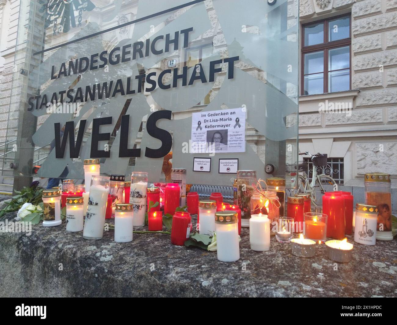 People attend a candle light memorial organised by initiative '# ...