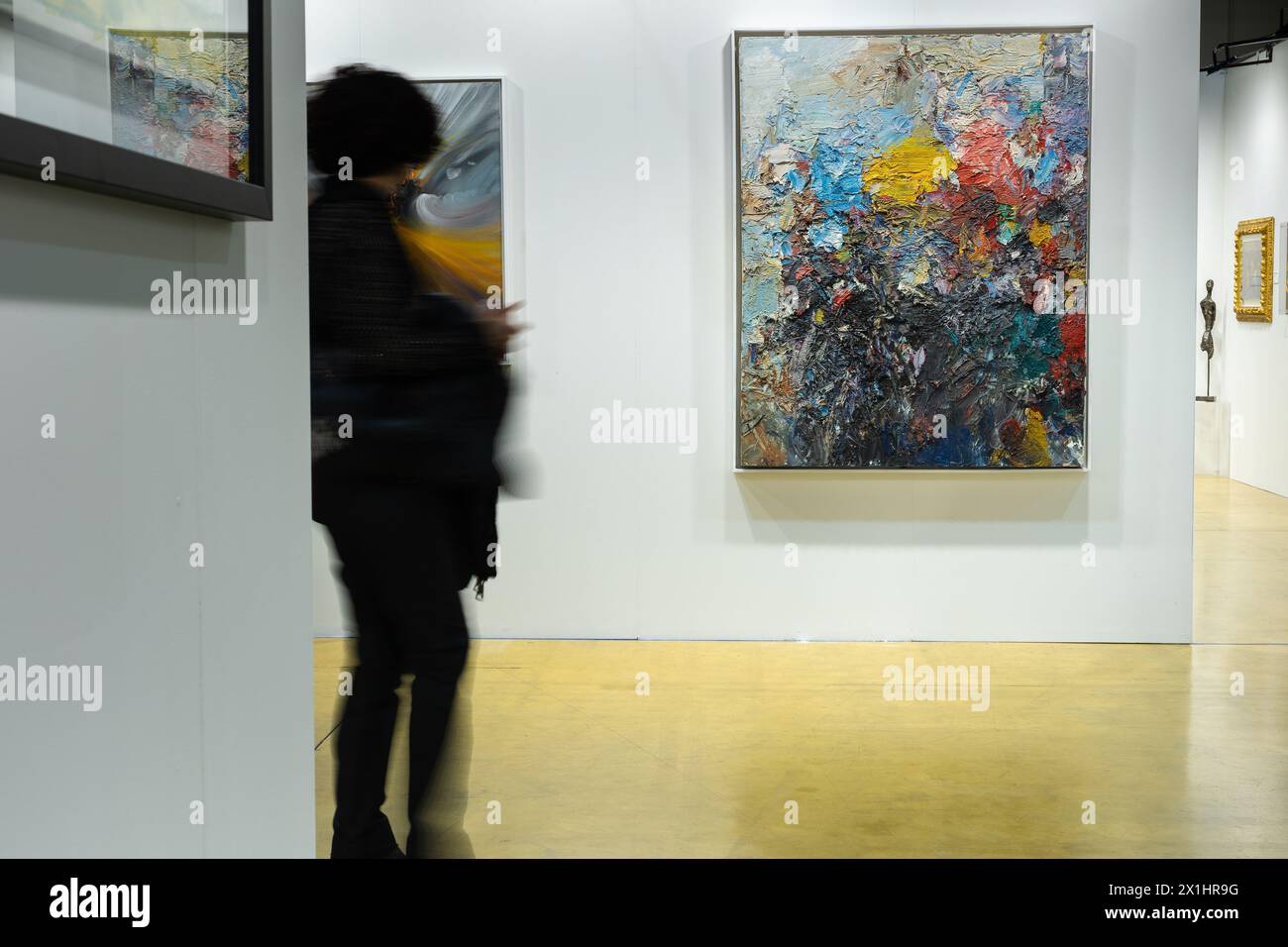 People Walking and Admiring Paintings in a Modern Art Gallery Stock ...