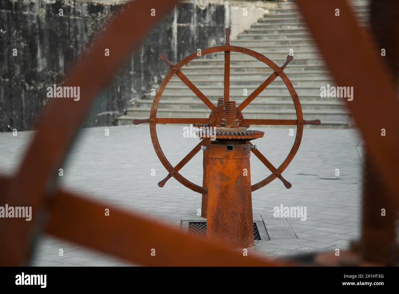 Rusty Valve in shape of wheel for opening a river dam Stock Photo - Alamy