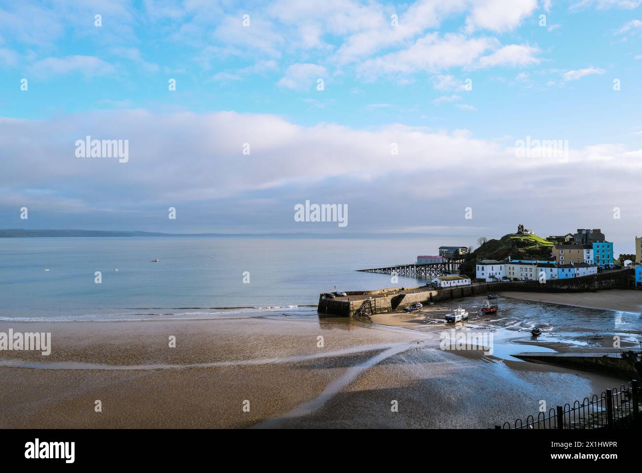 Tenby is a harbour town and resort in southwest Wales. It’s known for ...