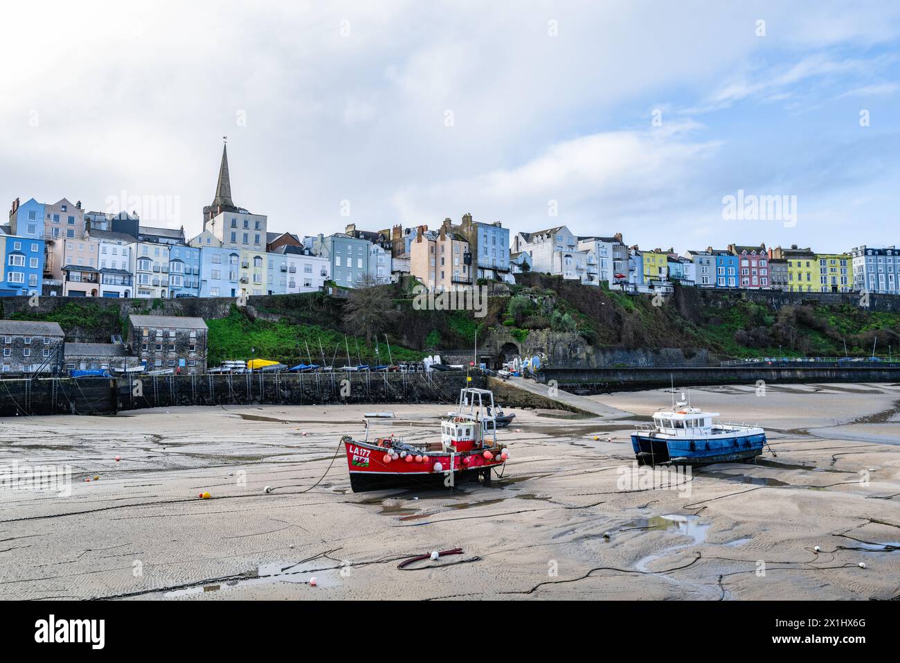 Tenby is a harbour town and resort in southwest Wales. It’s known for ...