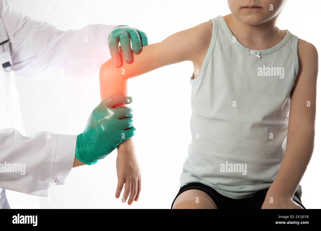 The hands of a traumatologist doctor in green medical gloves examine ...