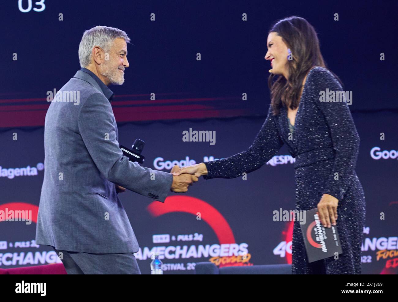 George Clooney and Elke Rock (Ö3) on stage during the 4GAMECHANGERS ...