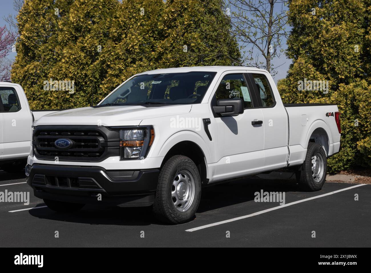 Zionsville - April 14, 2024: Ford F-150 display at a dealership. The ...