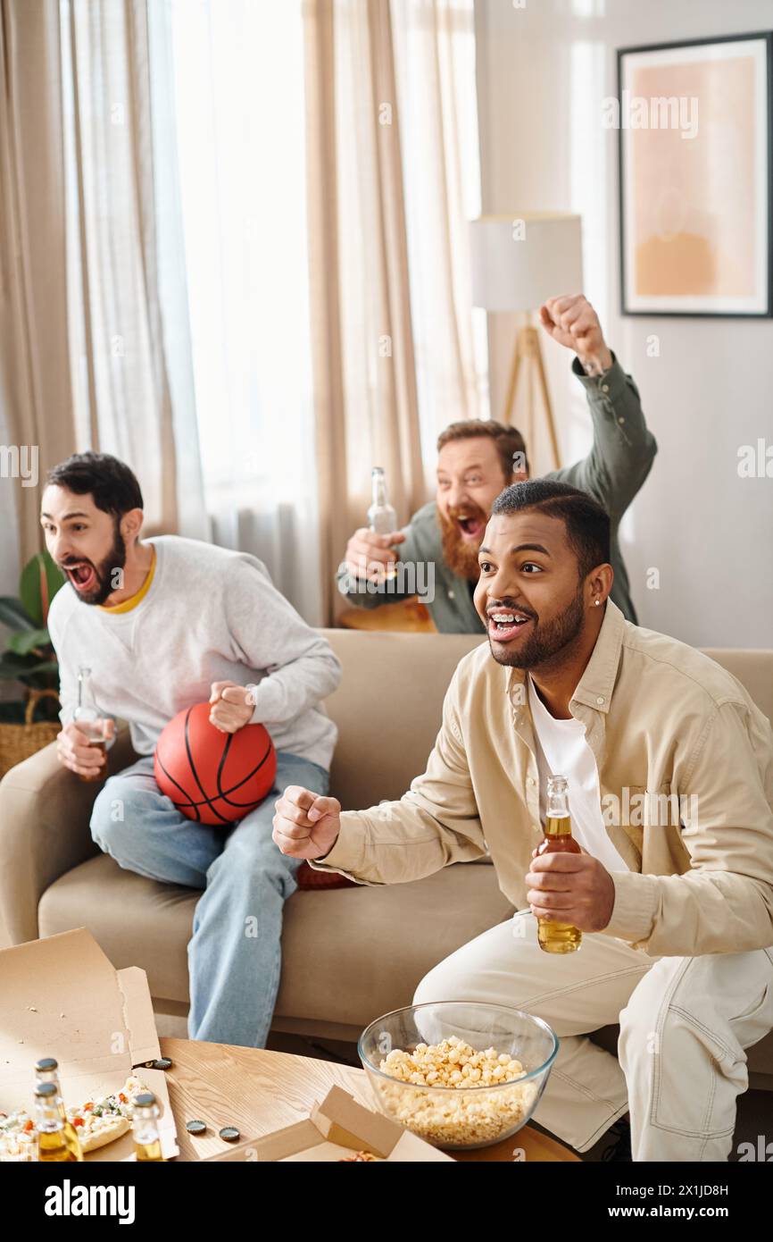 Three cheerful, interracial men in casual attire enjoy a moment of ...