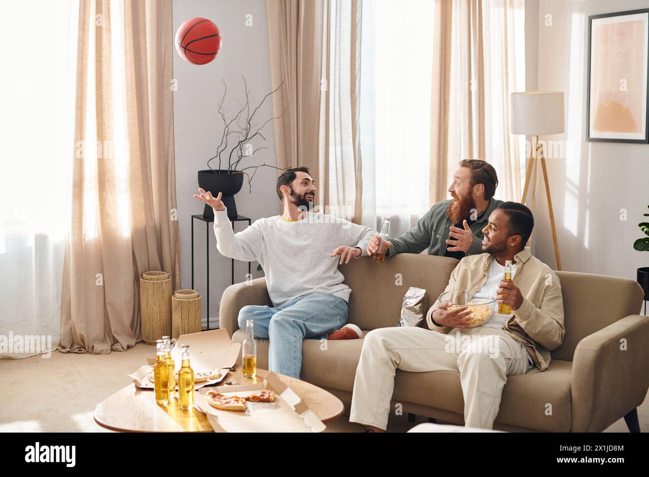 Three handsome men of different races sit happily and relax on top of a ...