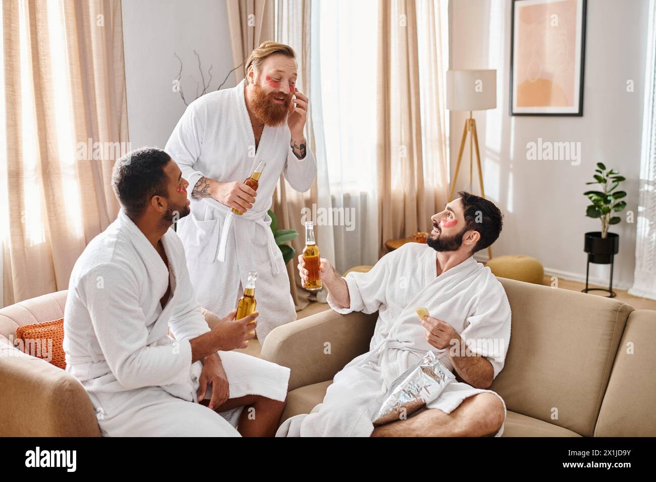 three men in white robes sit comfortably on a couch, enjoying each ...