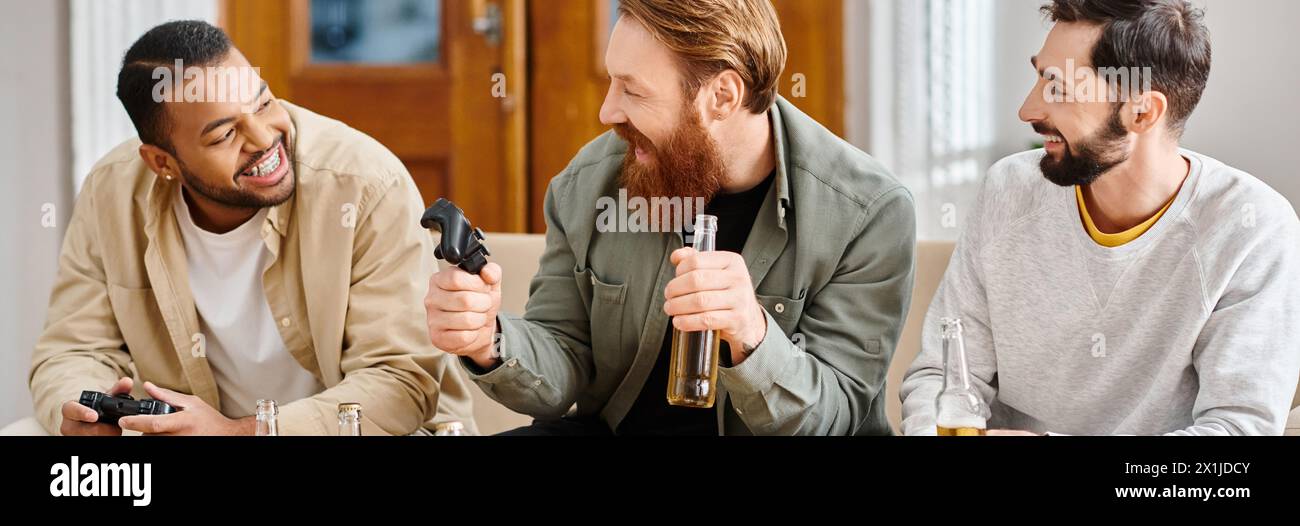 Three cheerful, handsome men in casual attire gather around a table ...