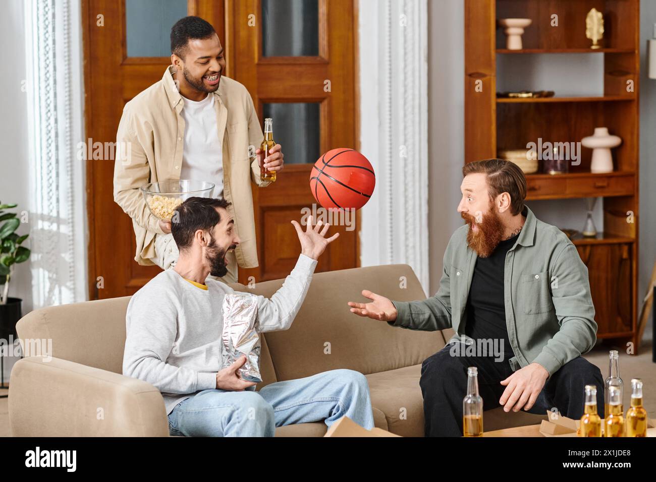 Three handsome, cheerful men of different races play an intense game of ...