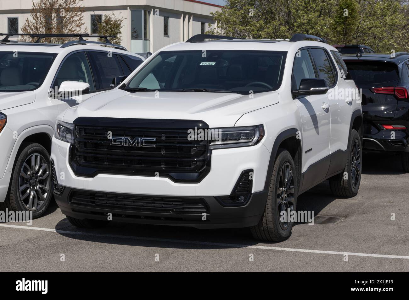 Carmel - April 14, 2024: GMC Acadia SUV display at a dealership. GMC ...