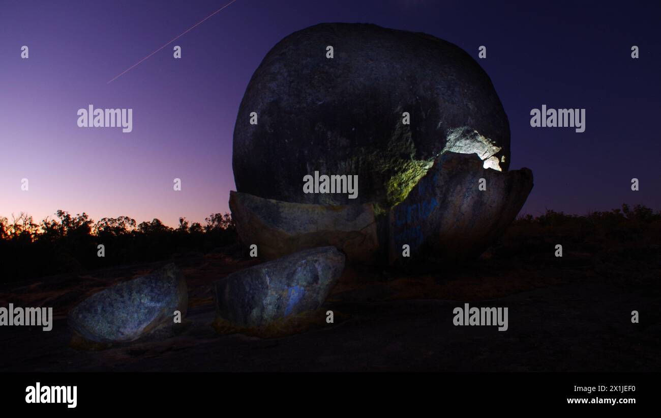 Cluster of large boulders at dusk highlighted with light painting Stock ...