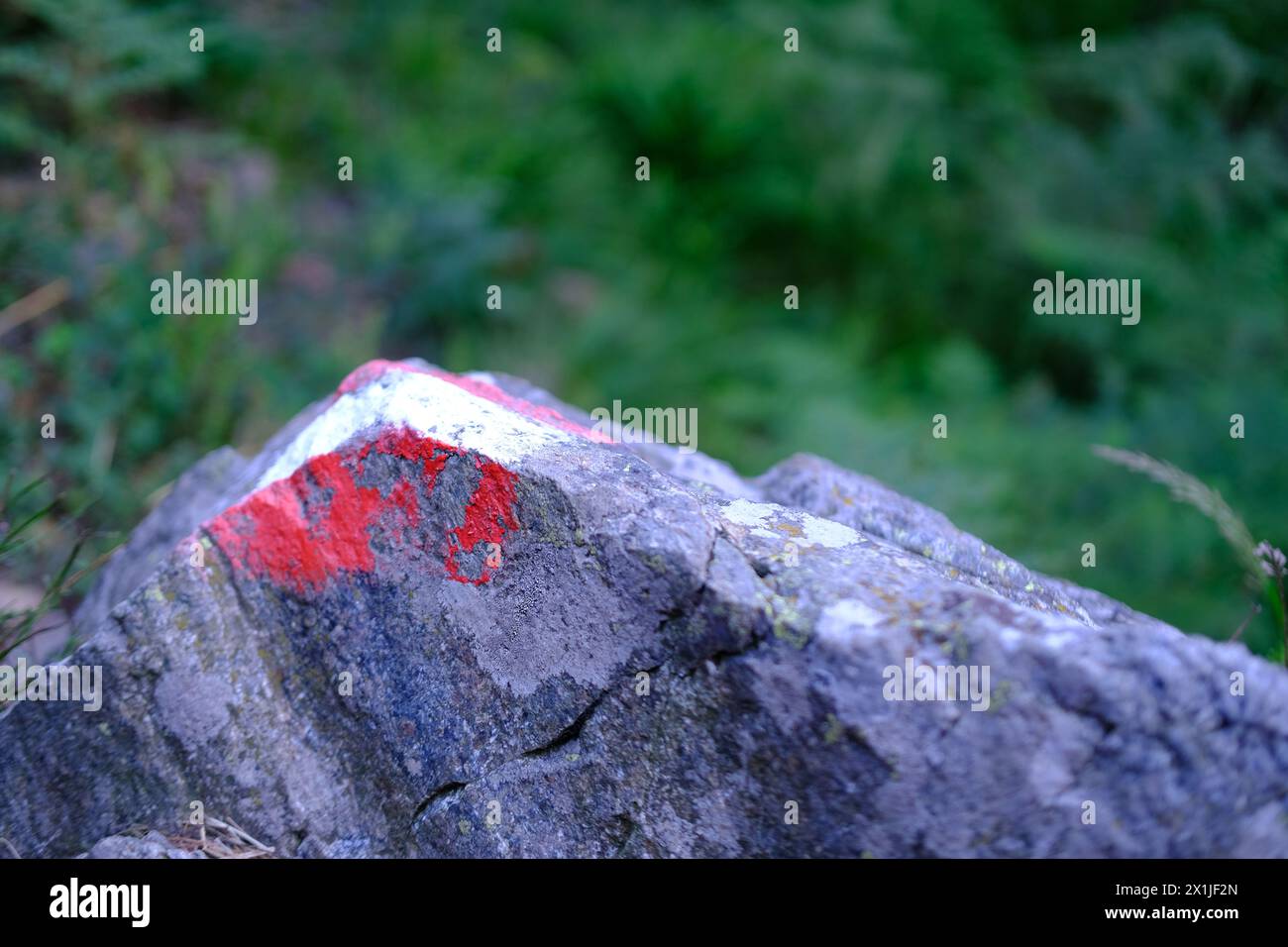 red, white marks on stone, waypoint on route, trail marker, Navigating ...