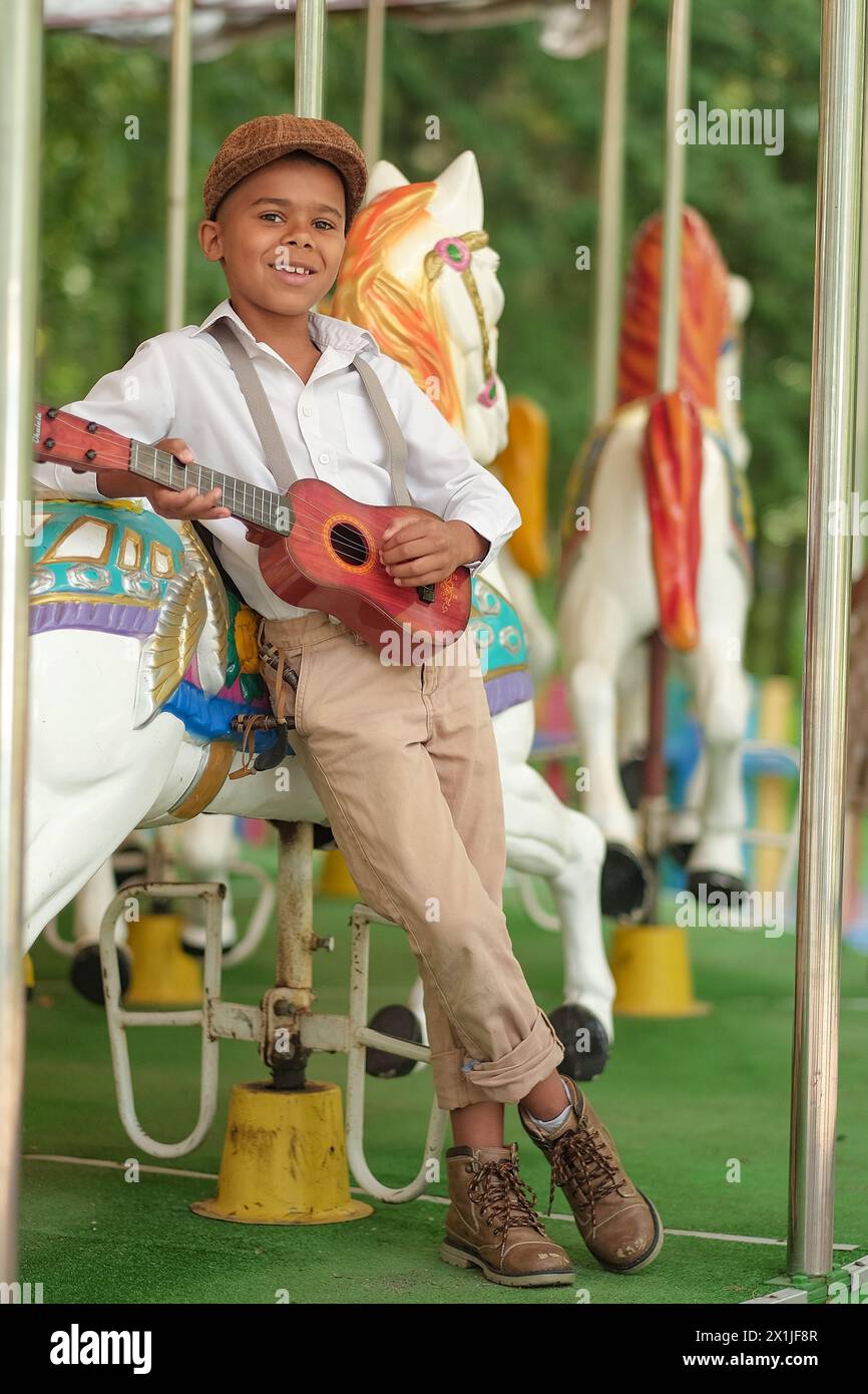 A handsome kid playing the guitar Stock Photo - Alamy