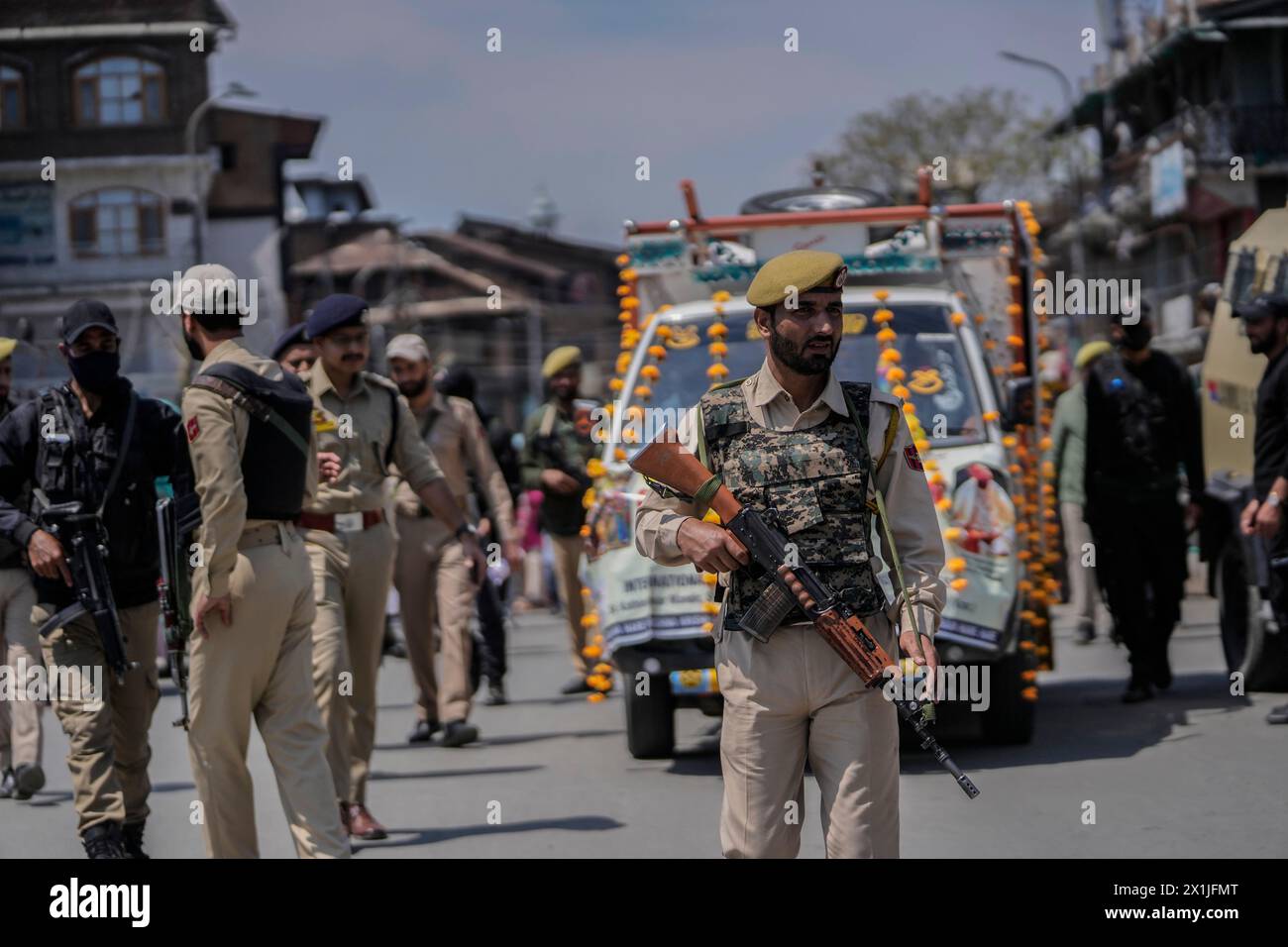Indian policemen guard during the Hindu procession to mark Ram Navami ...