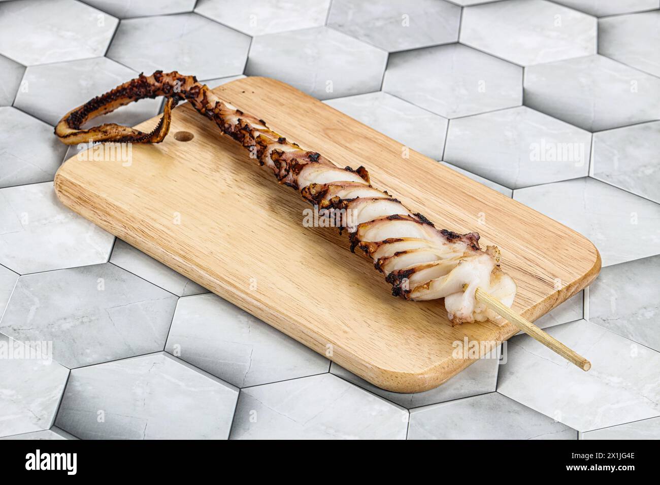 Delicous tasty Grilled octopus tentacle snack Stock Photo - Alamy