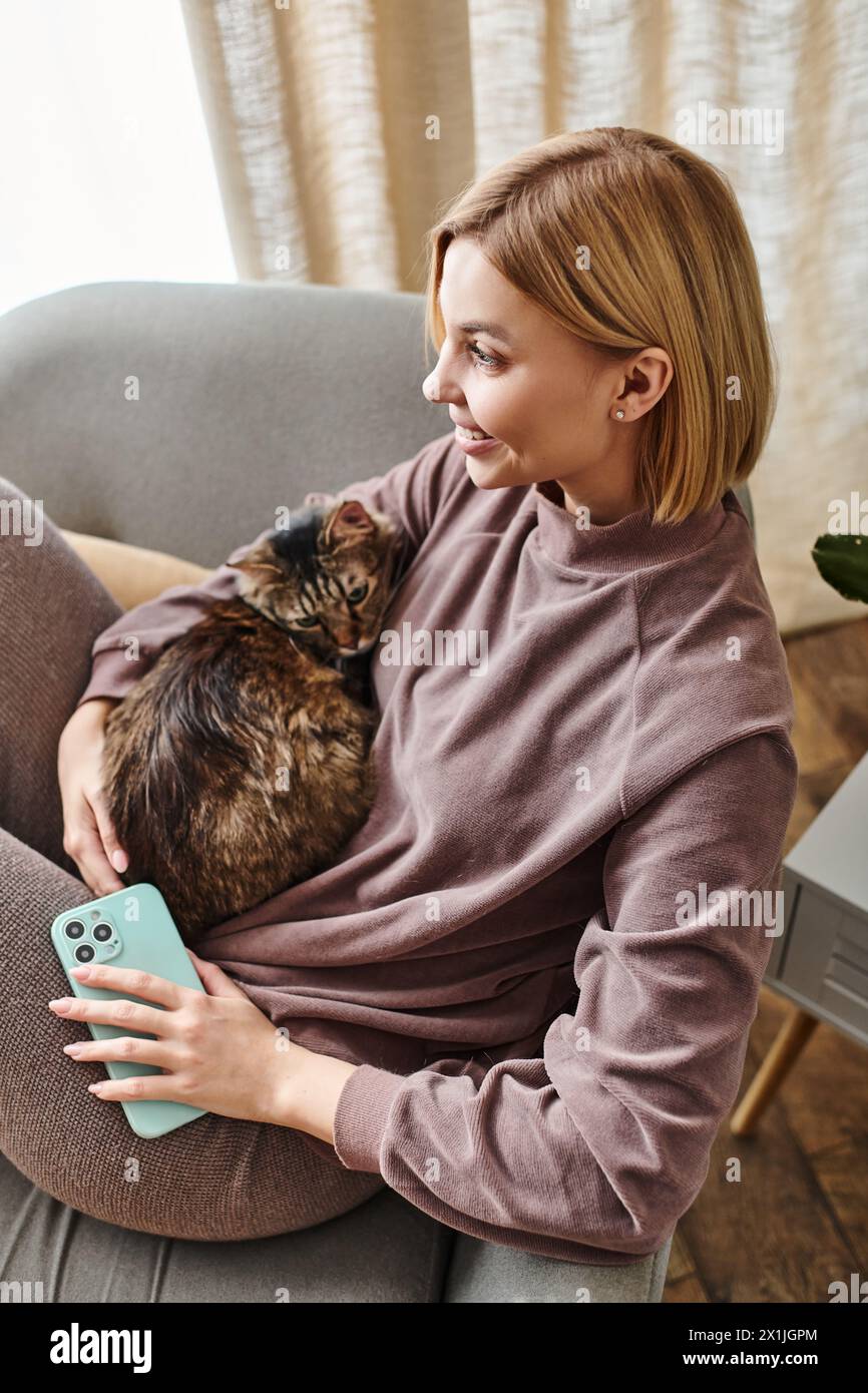 Joyful woman relaxes beloved cat hi-res stock photography and images ...