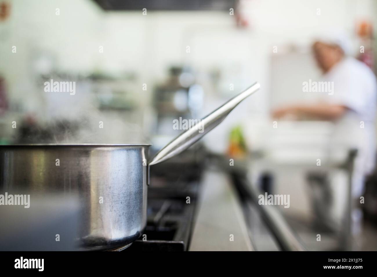 dipper warming up in industrial college kitchen before lunchtime Stock ...