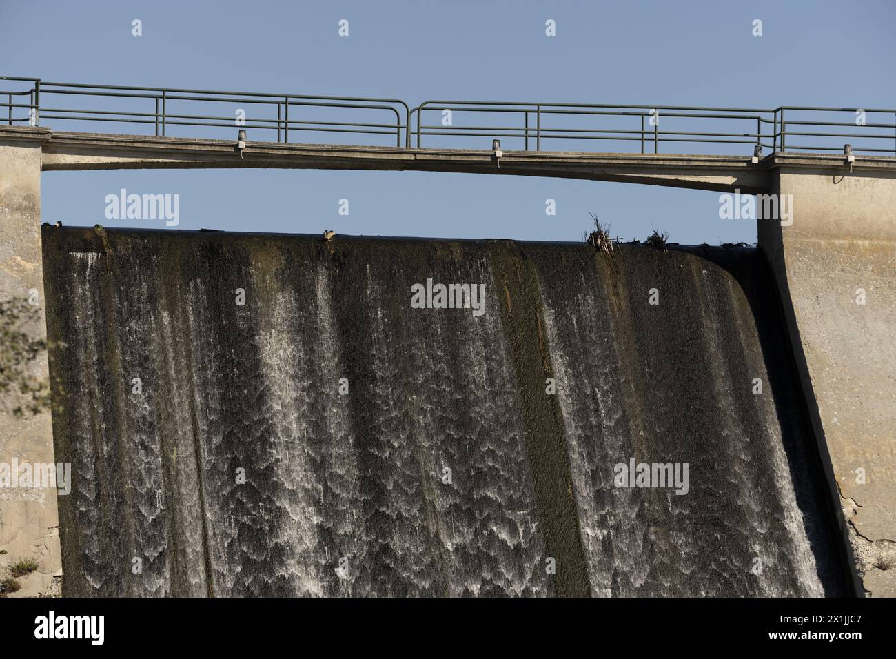 The gravity arch dam is one that combines characteristics of arch dams ...
