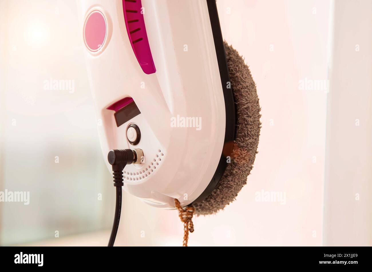 Automatic vacuum robot window washer washes glass from dirt. Modern ...