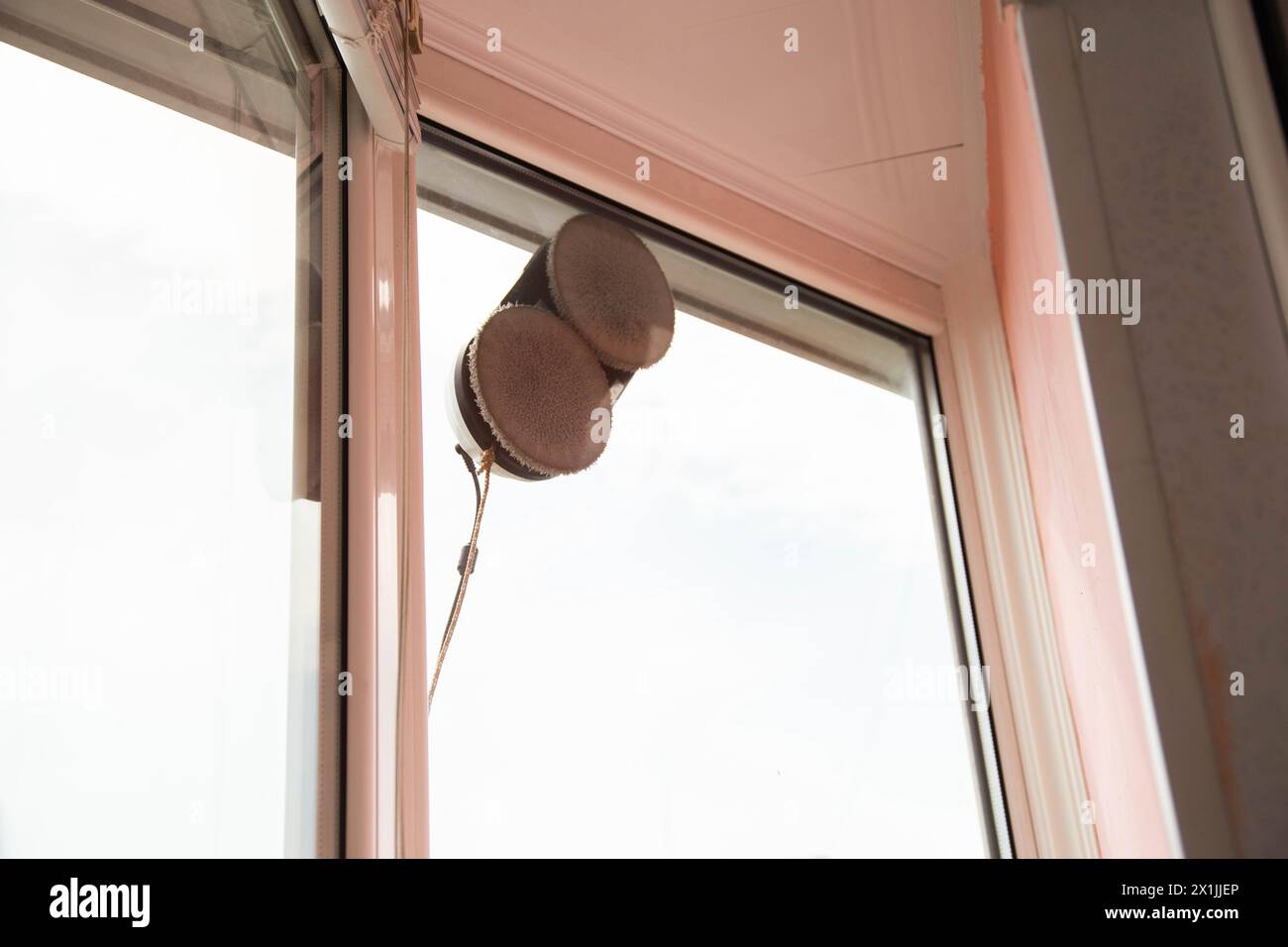 Automatic vacuum robot window washer washes glass from dirt. Modern ...