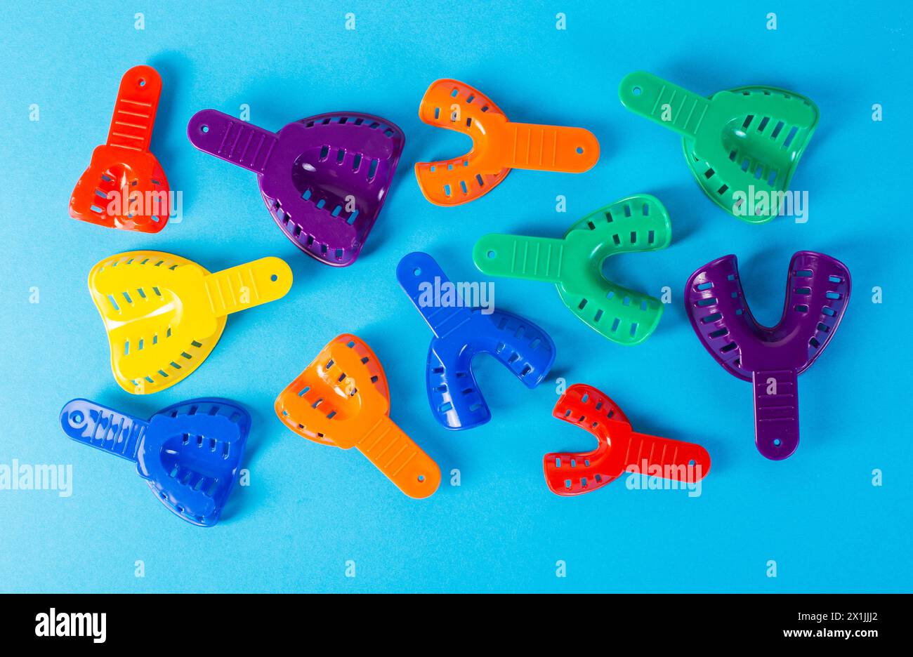 Multi-colored dental spoons for taking an impression of the dental jaw ...