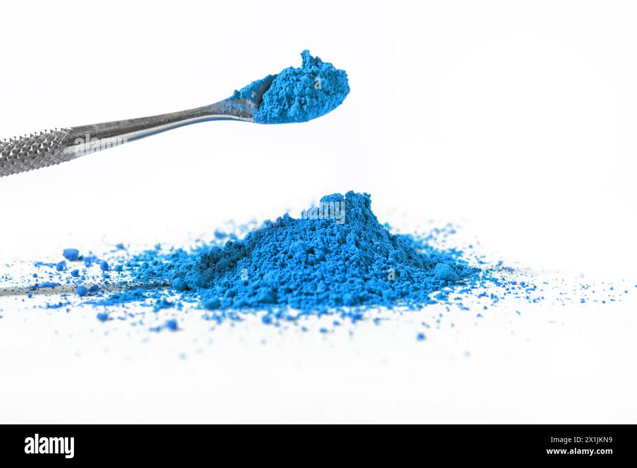 ceruleum blue pigment, dry natural paint on a white background, macro ...